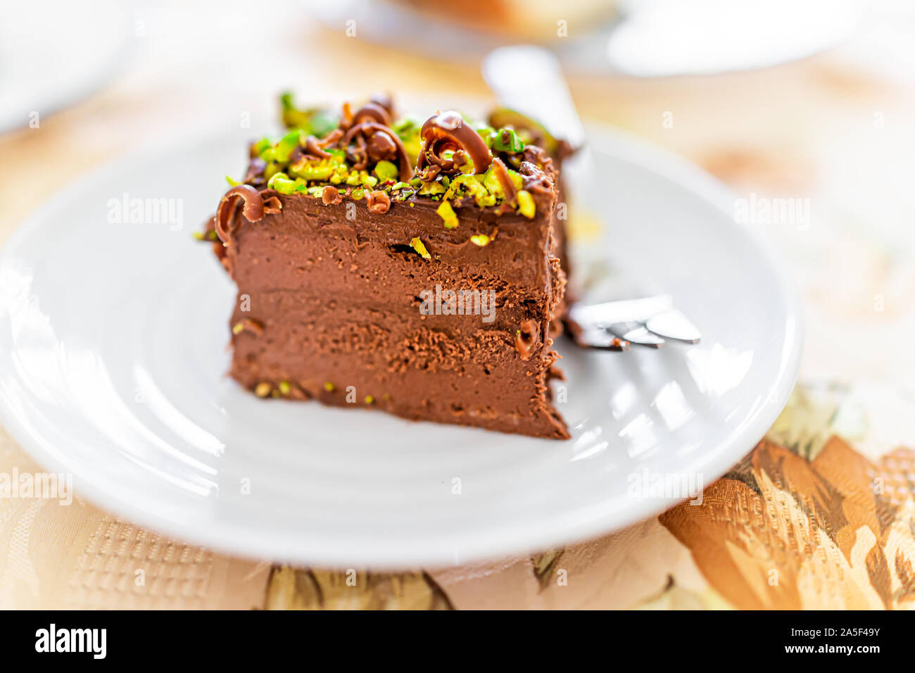 Ganache frosting chocolate sponge layer cake hi-res stock photography ...