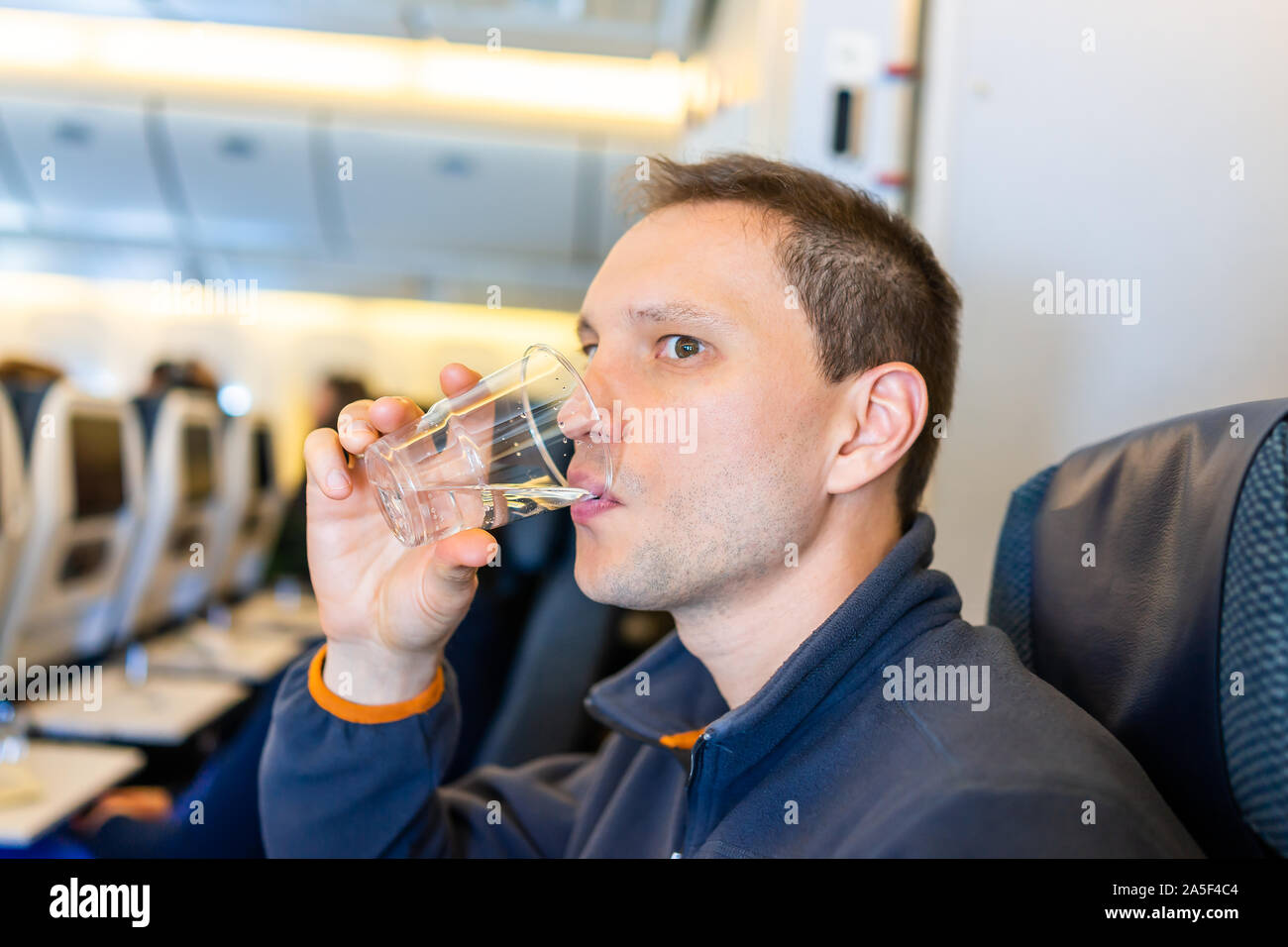 Economy class plane hi-res stock photography and images - Alamy