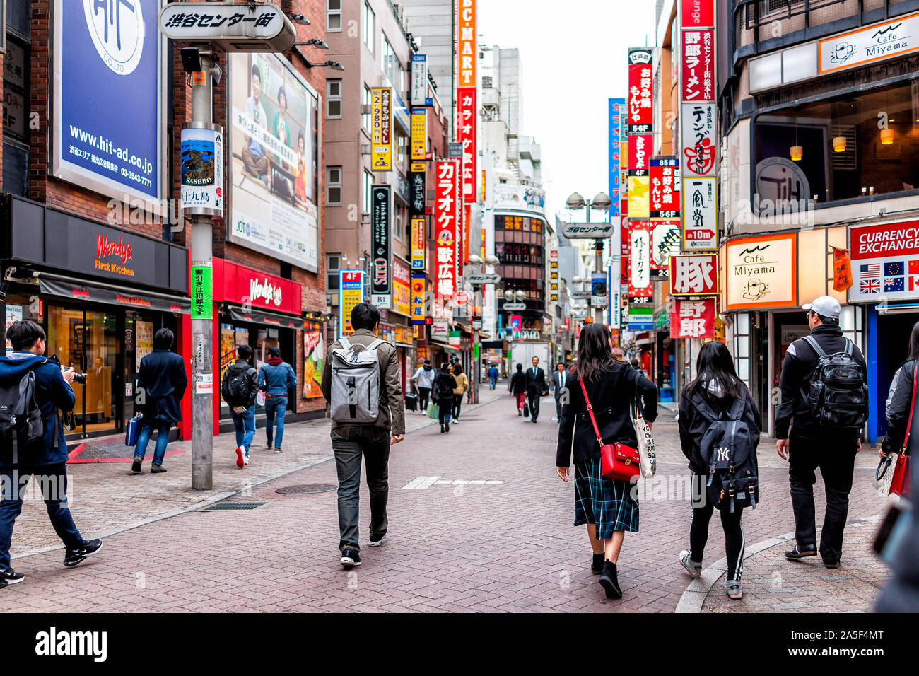 Tokyo, Japan - March 28, 2019: Shibuya district and famous Koen dori ...