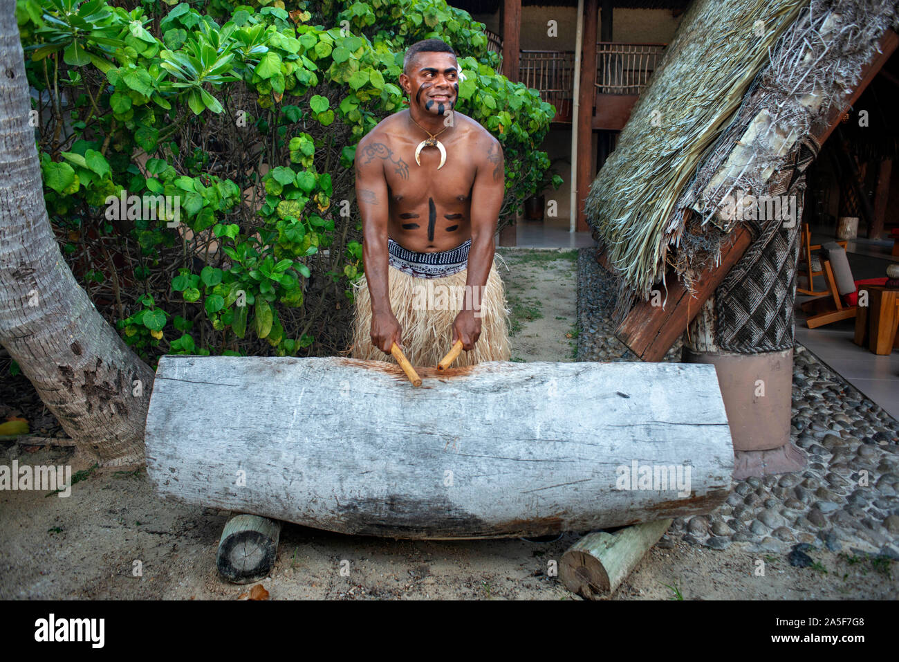 Tradtional Fijian Warrior playing the drum in Malolo Island Resort and ...