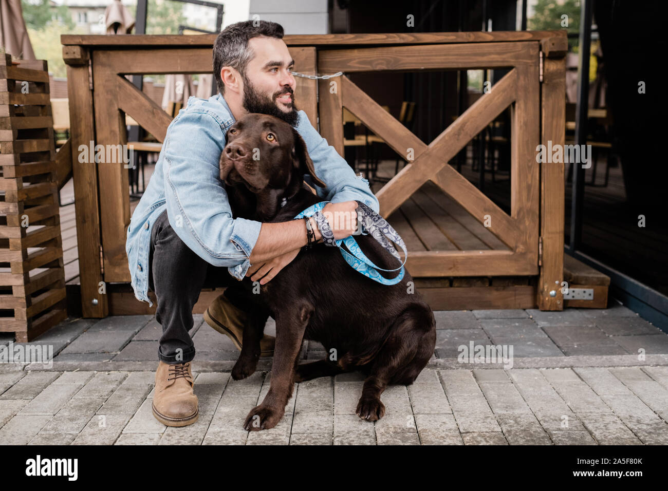 Handsome man dog embracing hi-res stock photography and images - Alamy