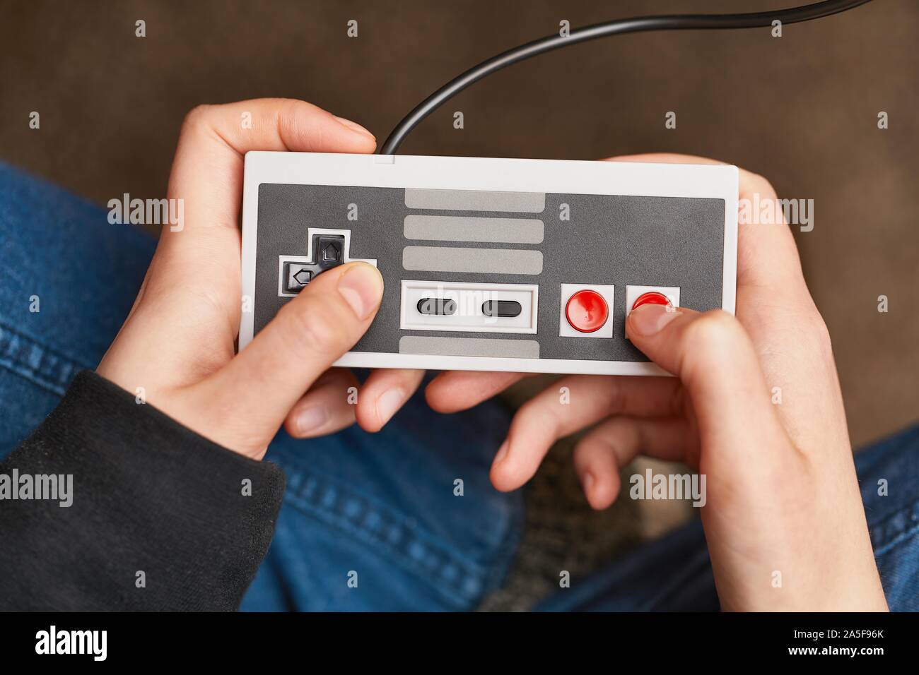 Playing an old gaming console Stock Photo - Alamy