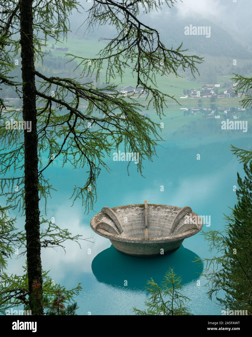 The lake Vernagt-Stausee (Schnalstal, South Tyrol, Italy) on a misty ...