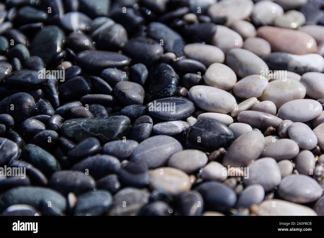 Pebble beach of the Aegean coast, Turkey, background Stock Photo - Alamy