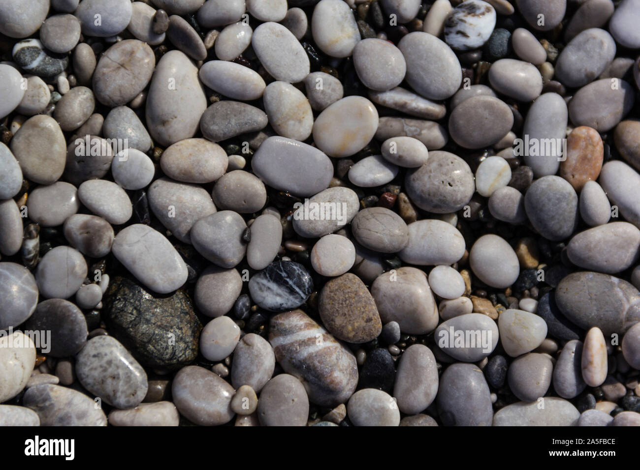 Pebble beach of the Aegean coast, Turkey, background Stock Photo - Alamy