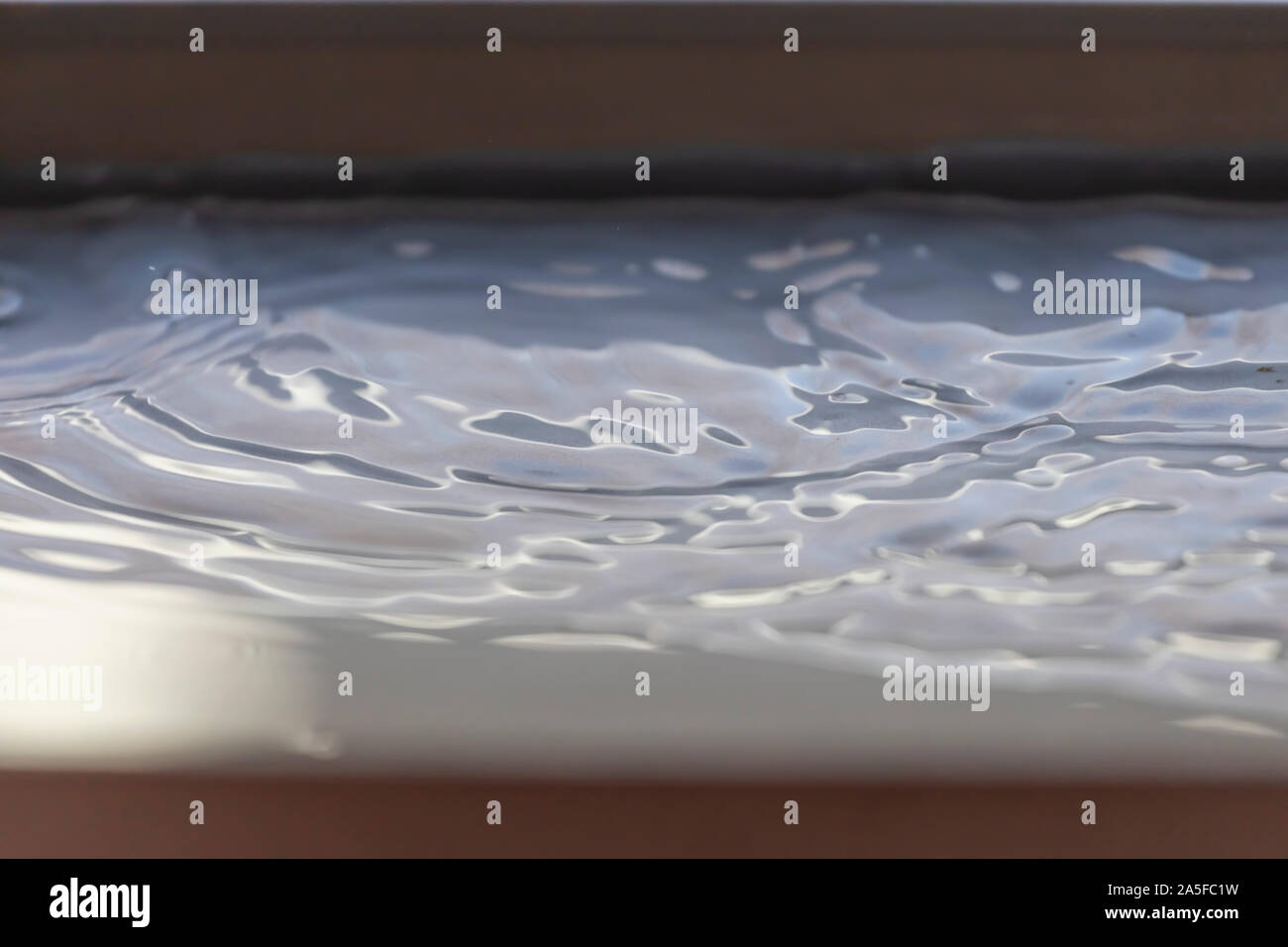 dripping water to the water surface Stock Photo - Alamy