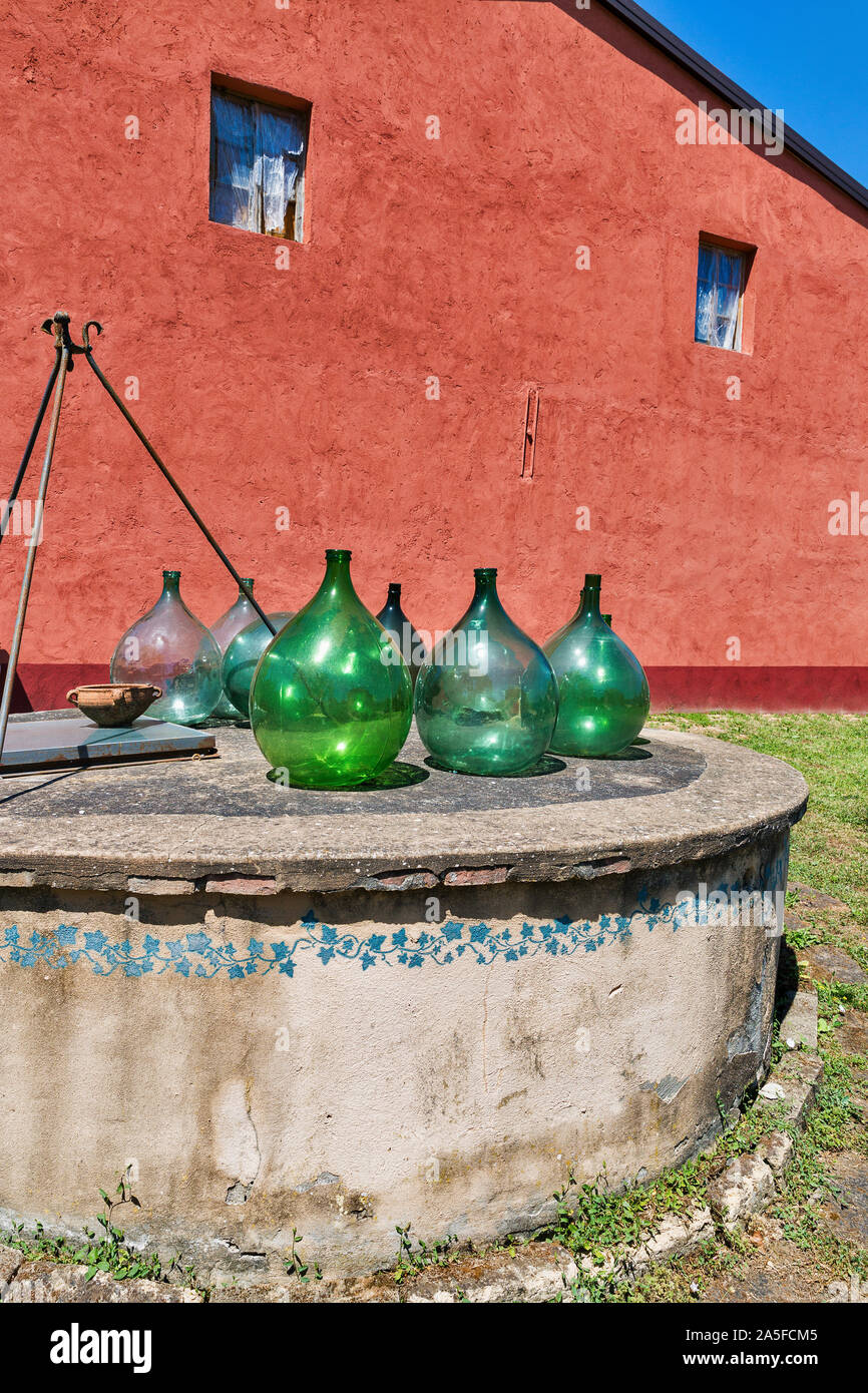 Water well with huge empty old wine jars closeup. Tuscany, Italy Stock ...