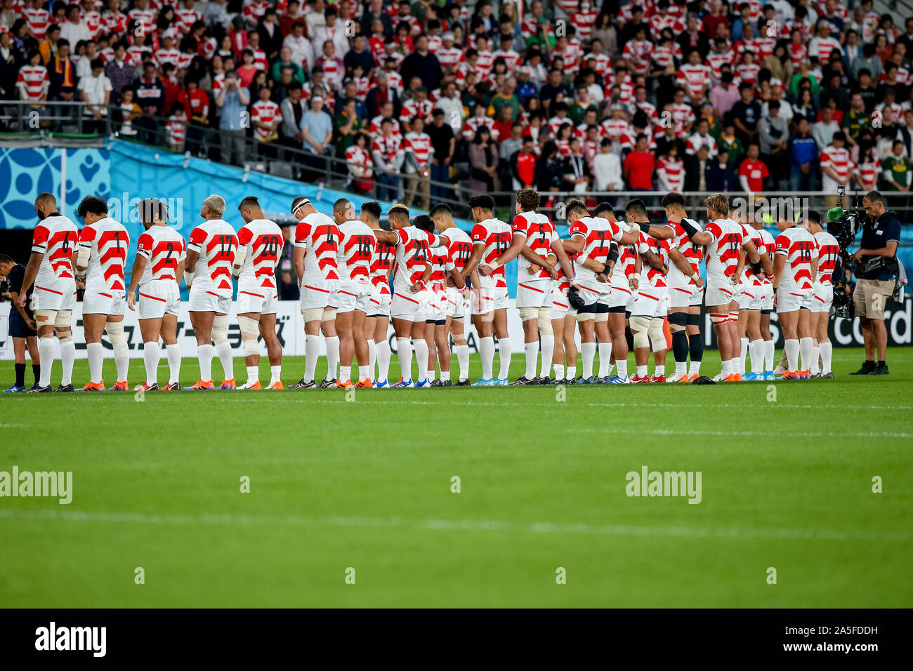 Tokyo, Japan. 20th Oct 2019. Japan team observes a minute of silence to ...