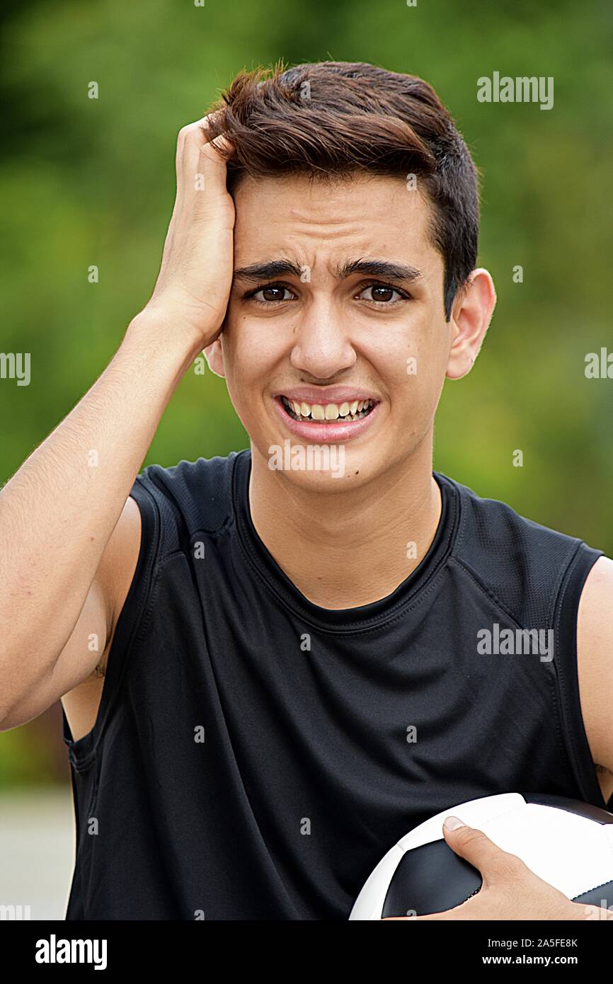 Confused Young Hispanic Soccer Player Stock Photo - Alamy