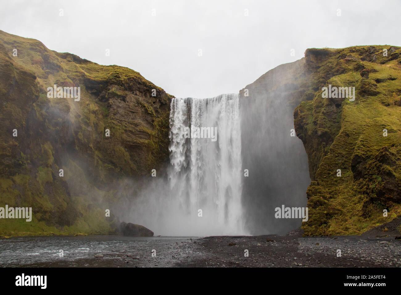 Waterfall in Iceland in cloudy weather Stock Photo - Alamy