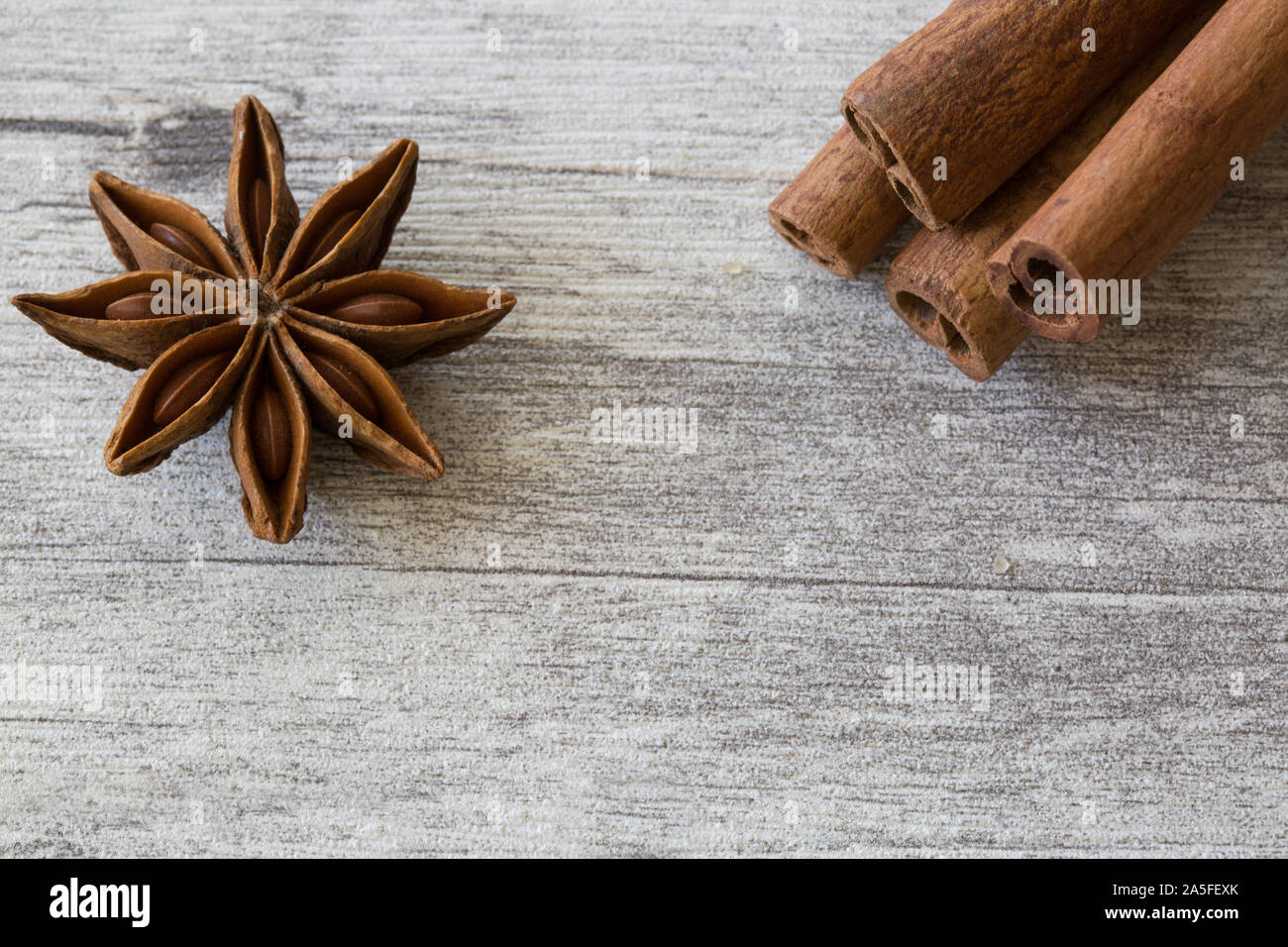 Anise star spices and cinnamon sticks on grey rystic wooden background ...