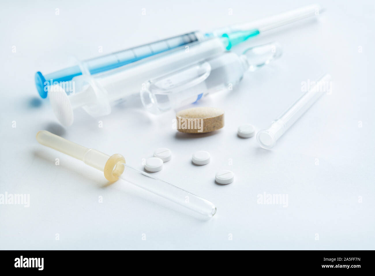 Pills, drugs, pipette and syringe on white background. Medicine concept ...