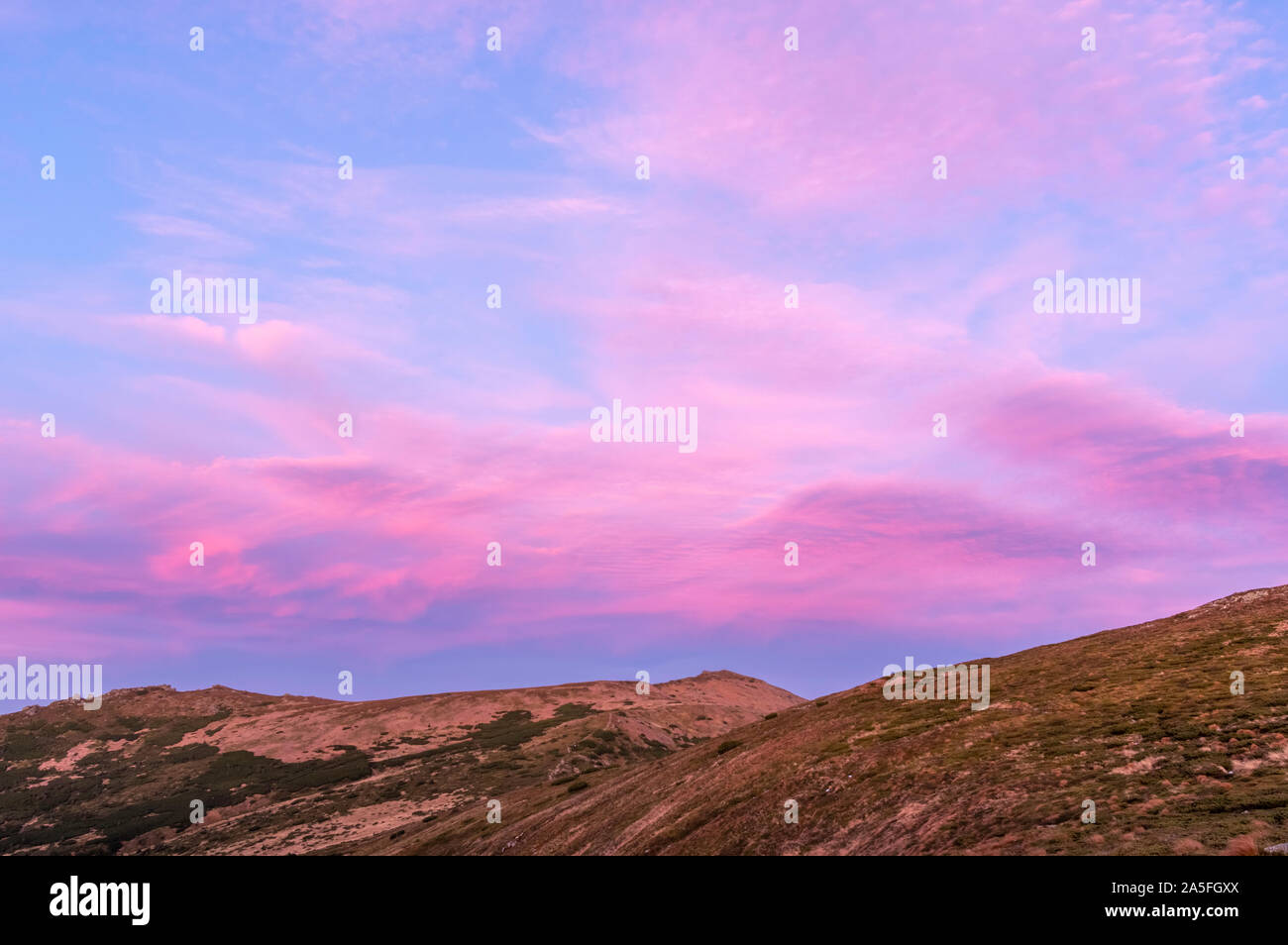 Unusually beautiful sky in the mountains. Beautiful purple sky. Magenta ...