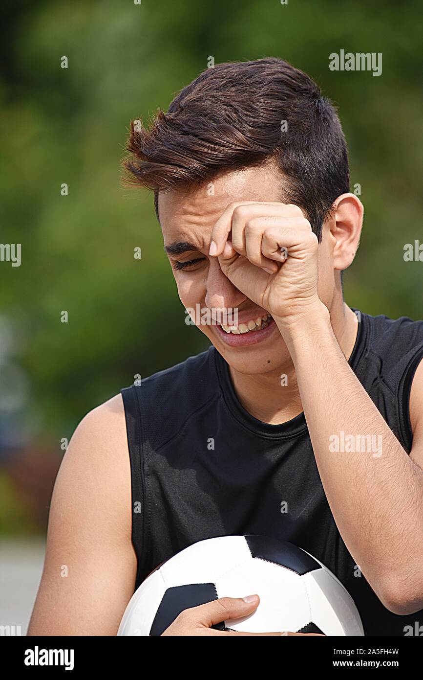Crying Young Male Soccer Player Stock Photo - Alamy