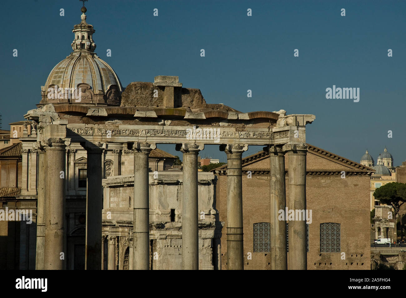 Columns of the temple of Saturn in the Roman Forum and the cupola of ...