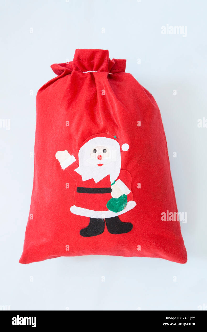 Santa Claus red bag on white background Stock Photo - Alamy