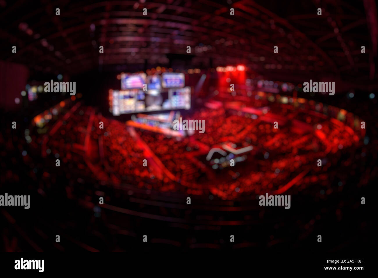 Blurred background of an esports event - Big illuminated main stage of ...