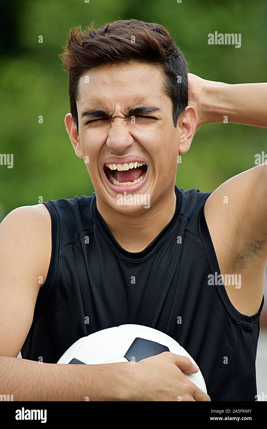 Fit Male Soccer Player Under Stress Stock Photo - Alamy