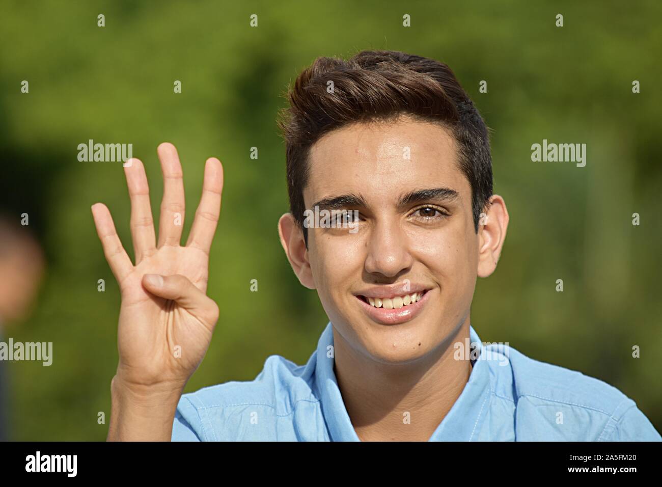 Youthful Colombian Male Counting Stock Photo - Alamy