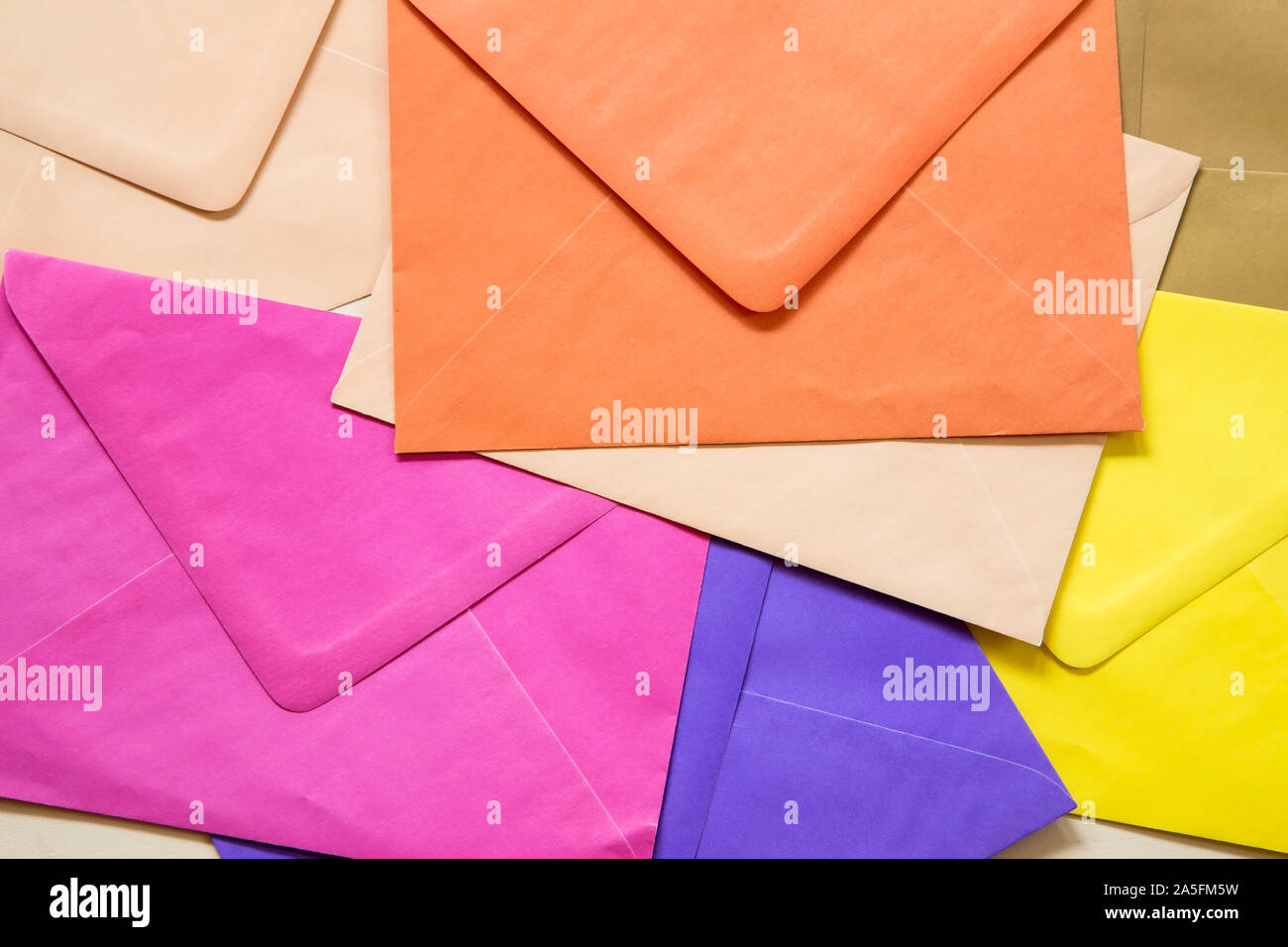 Pile of the colorful envelopes as background Stock Photo - Alamy