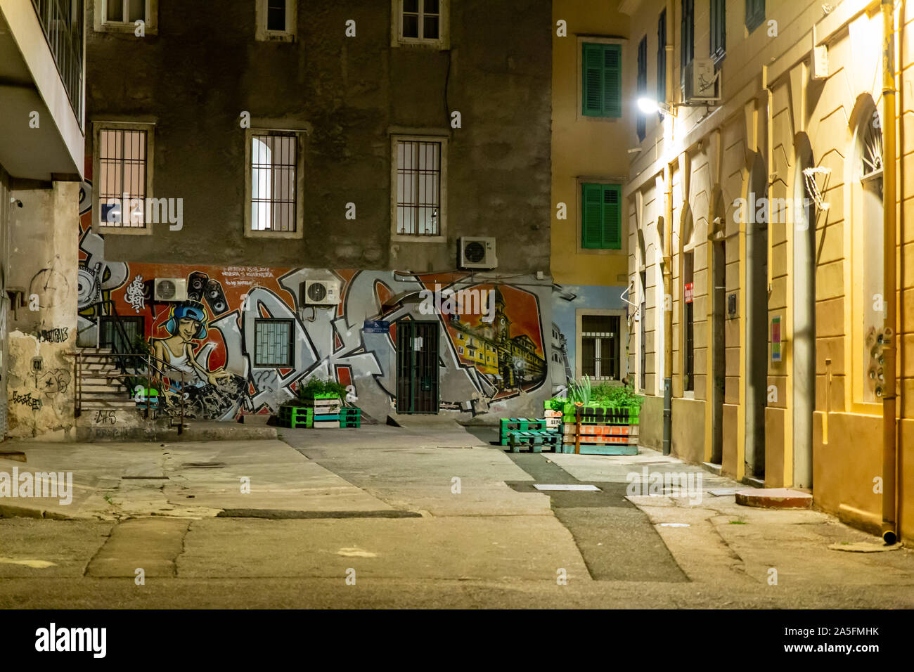 An urban back street decorated with street art in the centre of Rijeka ...