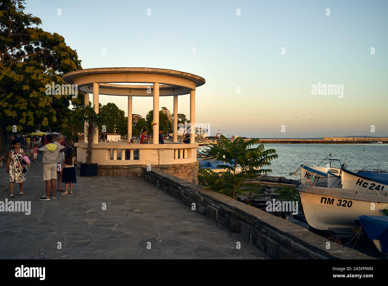 POMORIE, BULGARIA - JUNE 30, 2019: Promenade with tourists and fishing ...