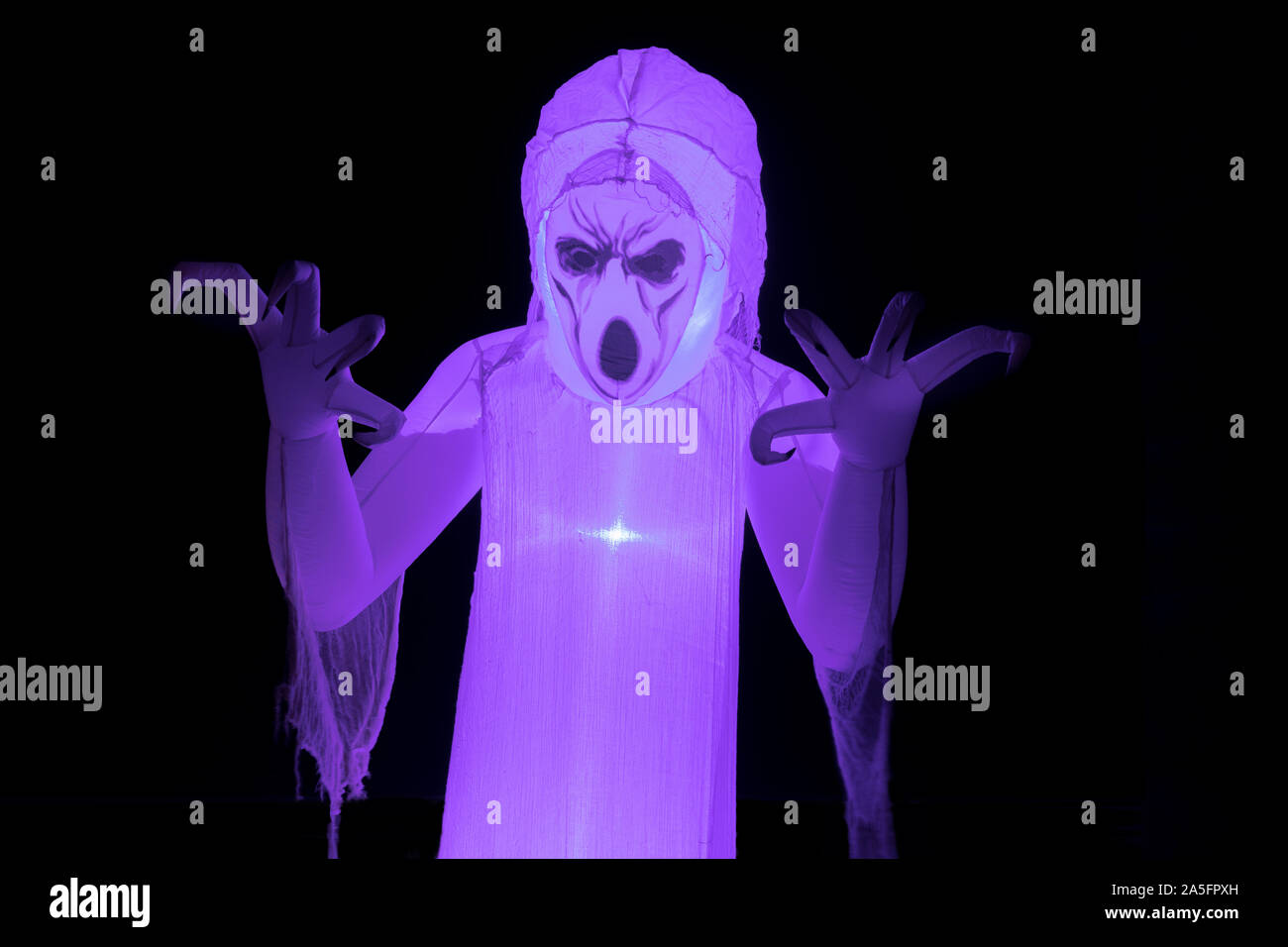 Angry Ghost Glowing In The Dark Stock Photo - Alamy