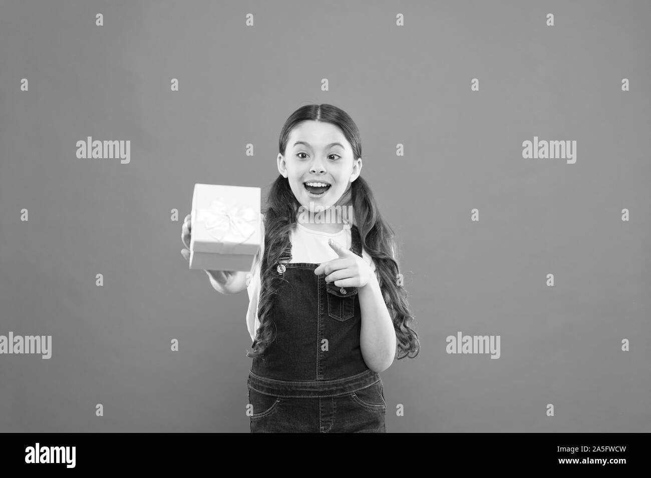 The earliest delivery with quality. Adorable little girl holding ...