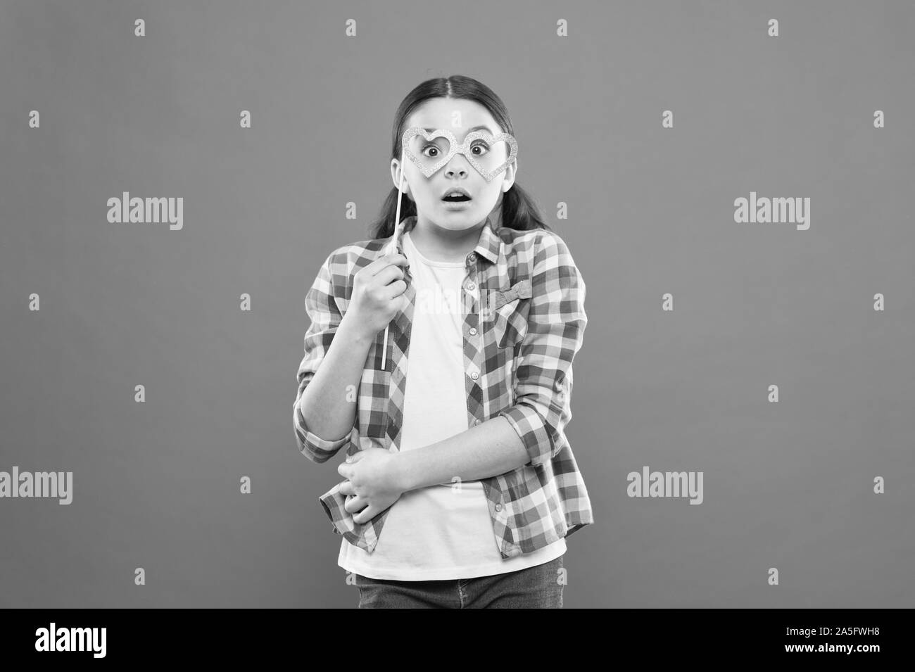 I am surprised at you. Surprised small child looking through prop party ...