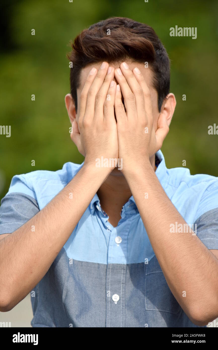 Shameful Teenage Boy Stock Photo - Alamy
