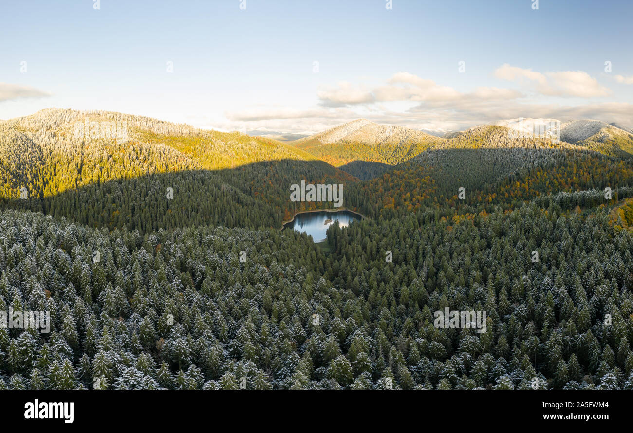 big lake in the middle of mountains during autumn Stock Photo - Alamy
