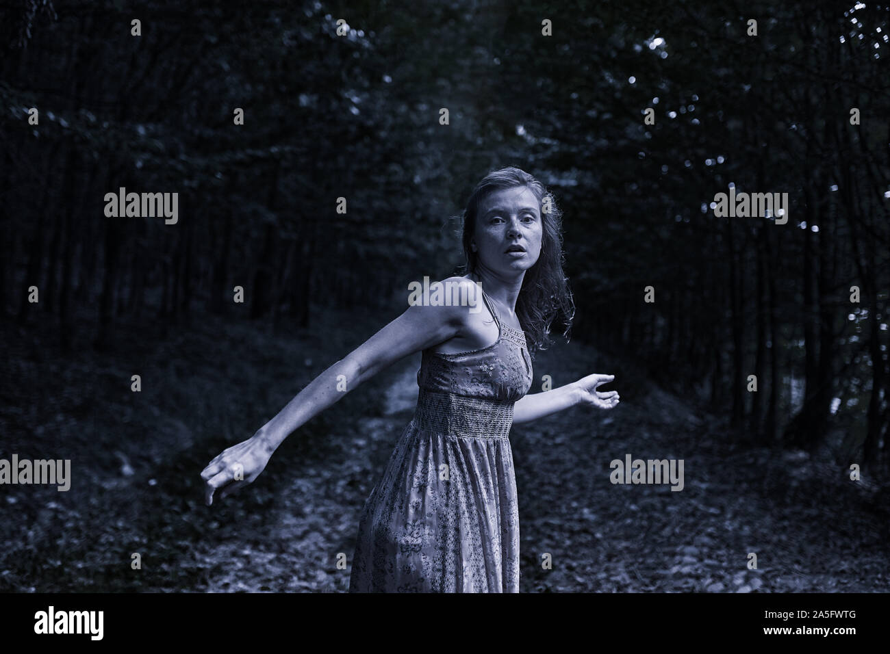 Woman running scared hi-res stock photography and images - Alamy