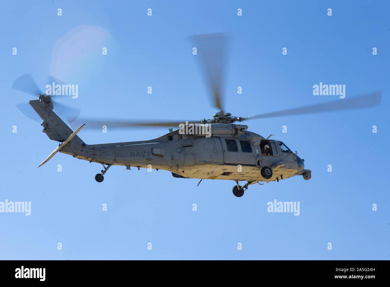 A U.S. Navy MH-60R Seahawk aircraft prepares to land at a forward ...