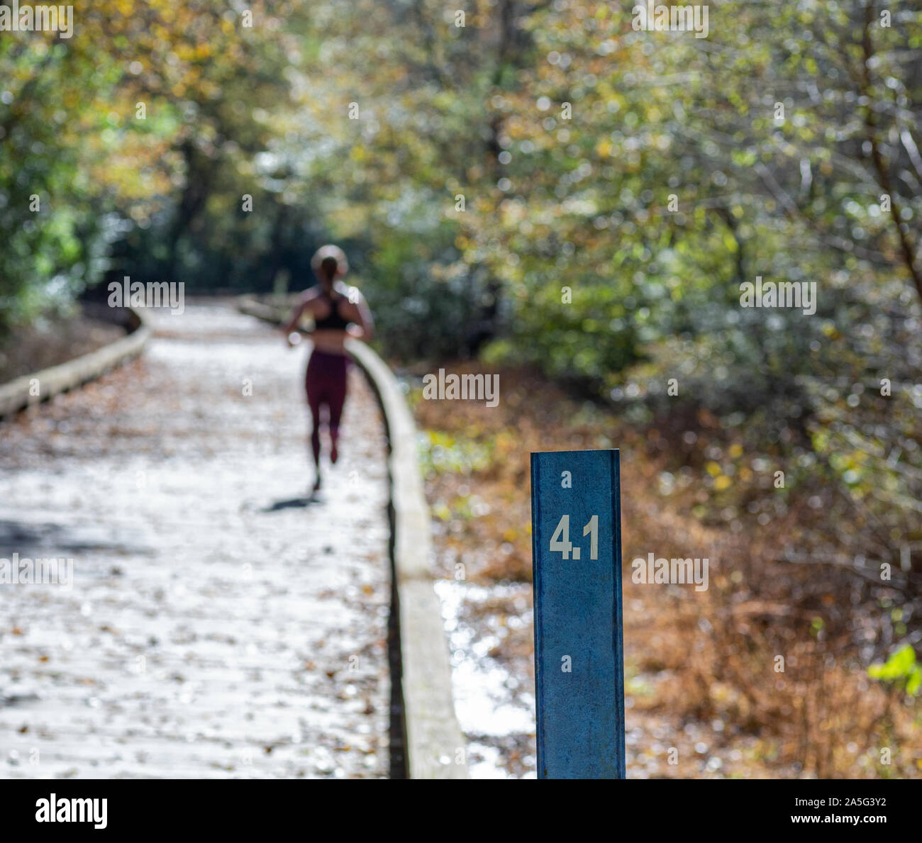 Running Past 4.1 Mile Marker Stock Photo - Alamy