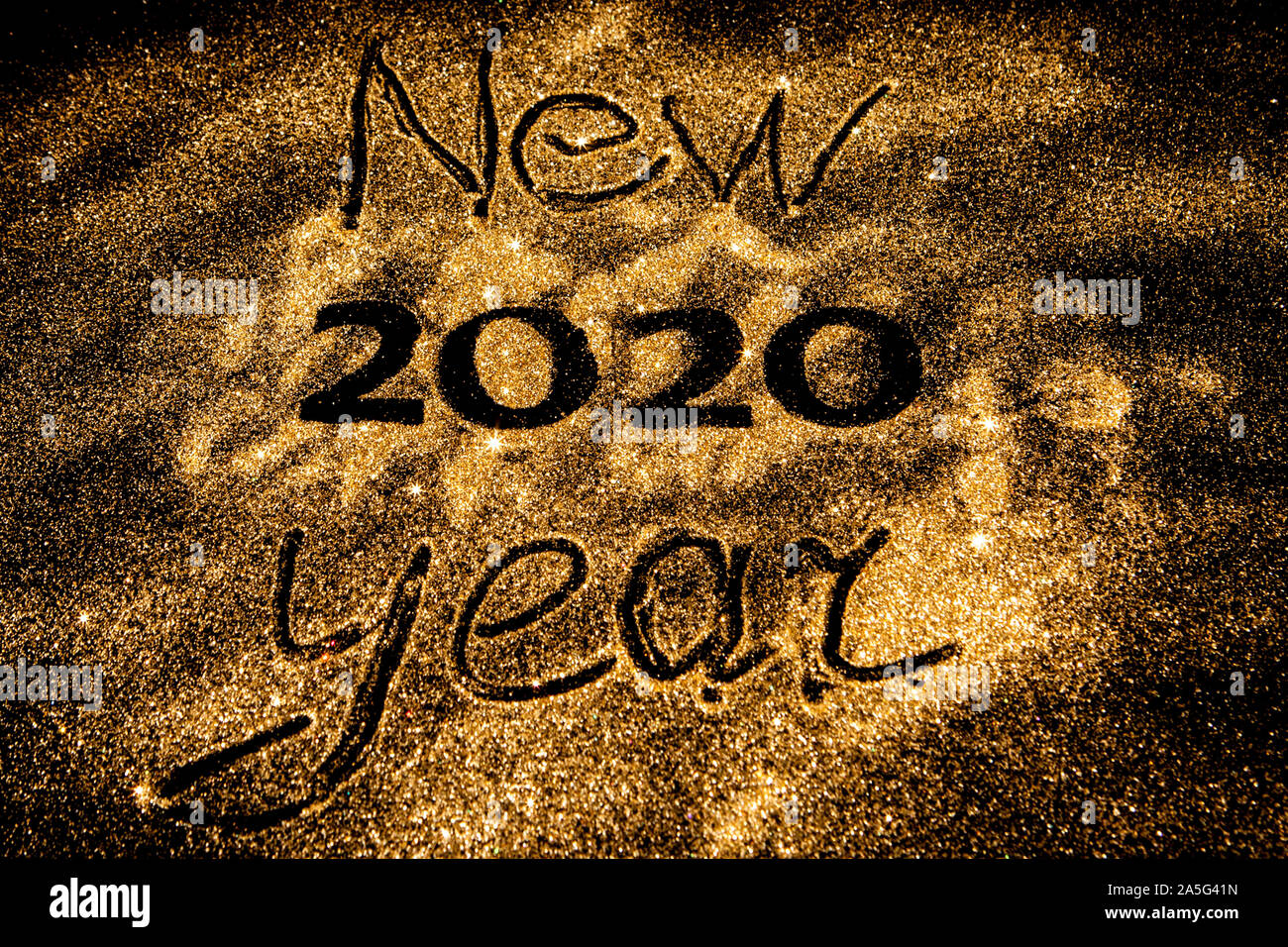 Happy New Year 2020. Beautiful sparkling Golden number 2020 on black ...