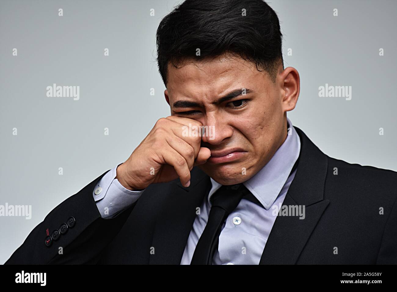 Latino Business Man Crying Wearing Suit And Tie Stock Photo - Alamy