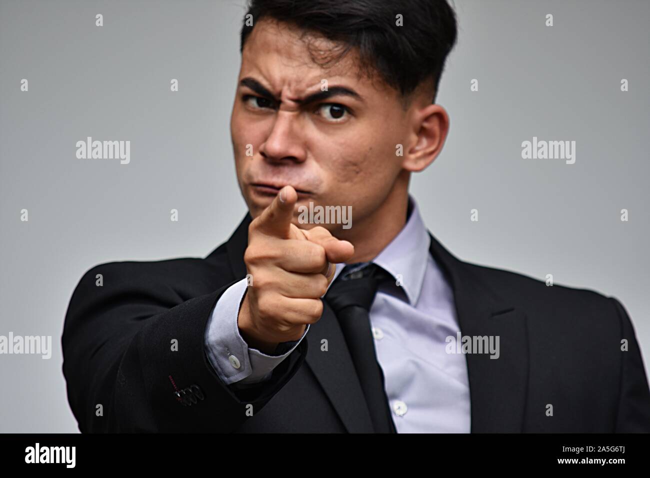 Minority Business Man Pointing Stock Photo - Alamy