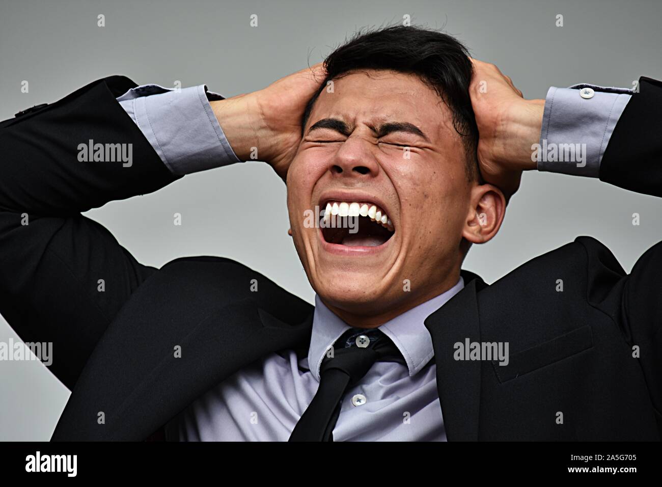 Handsome Business Man Under Stress Wearing Suit And Tie Stock Photo - Alamy