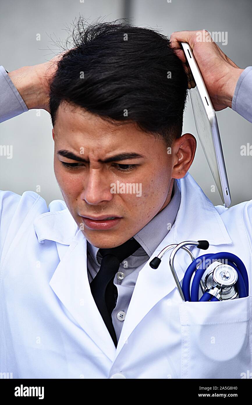 Confused Male Doctor Stock Photo - Alamy