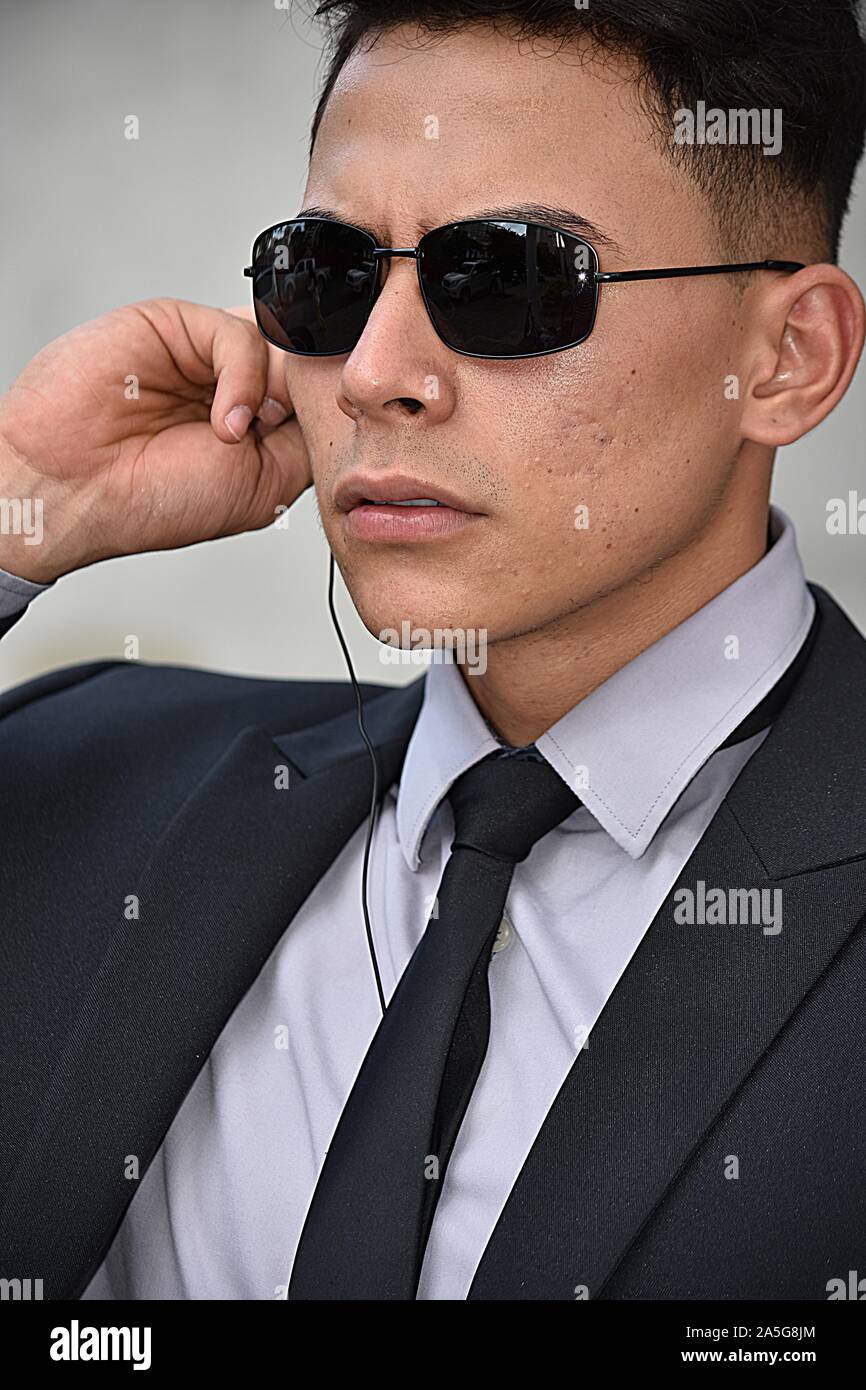 Minority Security Guard Looking Stock Photo - Alamy