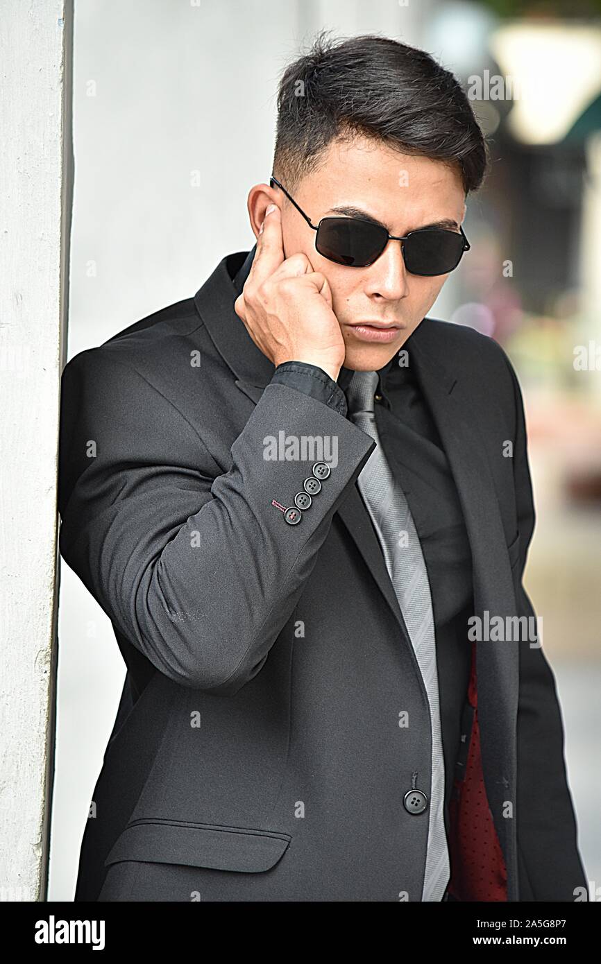 Colombian Security Guard Hearing Wearing Sunglasses Stock Photo - Alamy