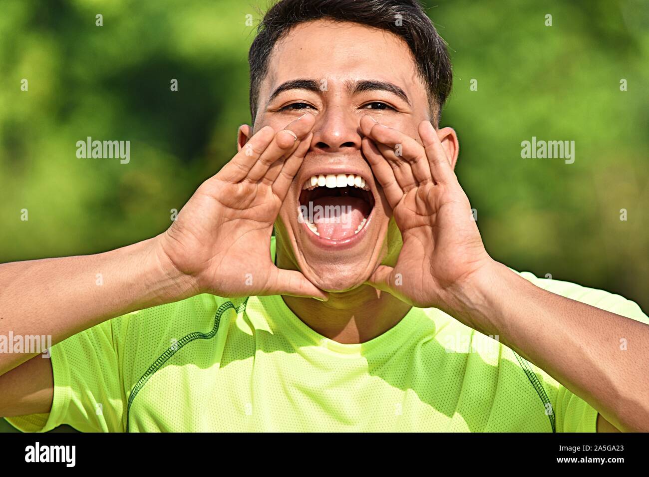 Male Athlete Shouting Stock Photo - Alamy