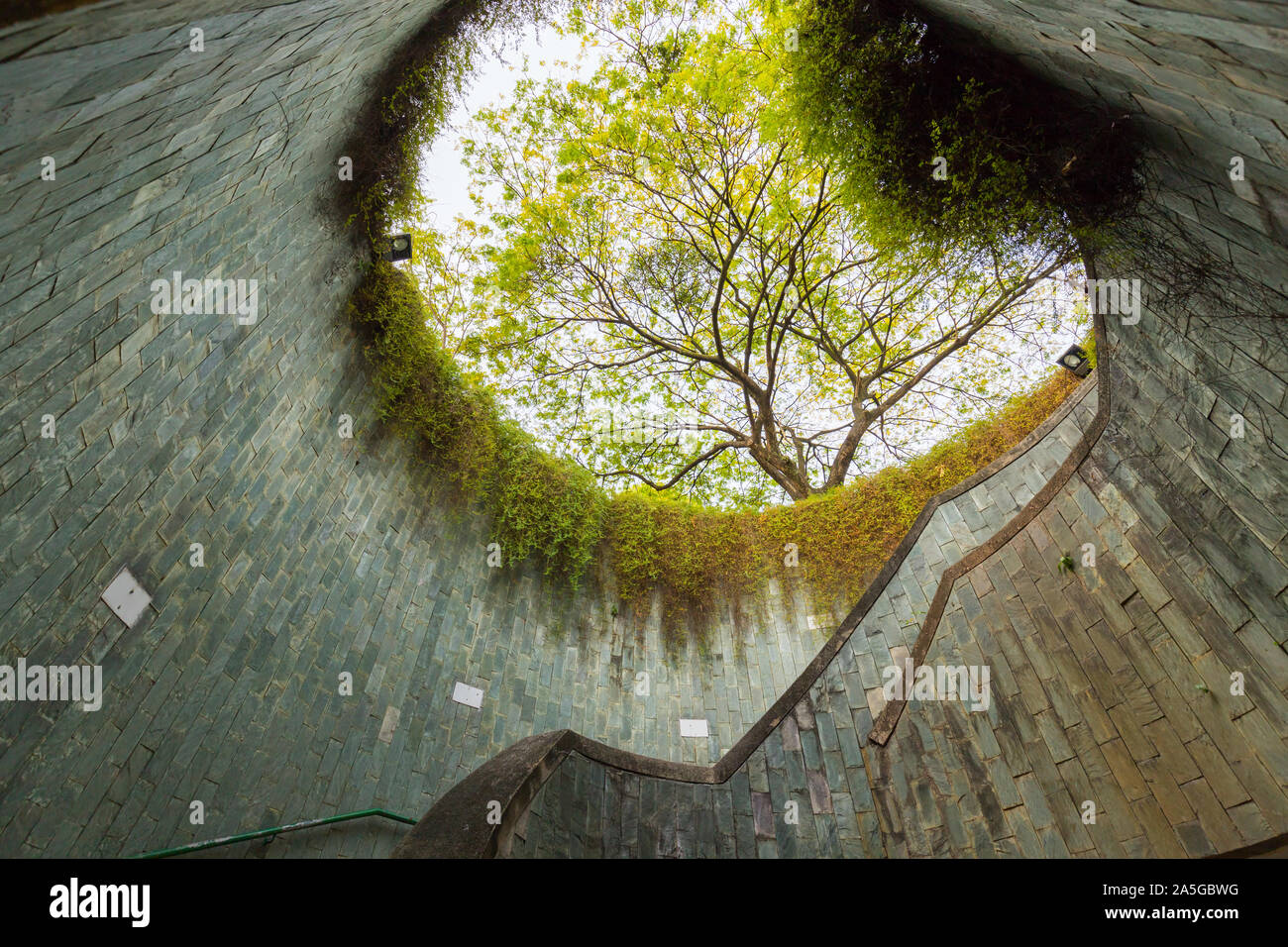 Spiral staircase of underground crossing in tunnel at Fort Canning Park ...