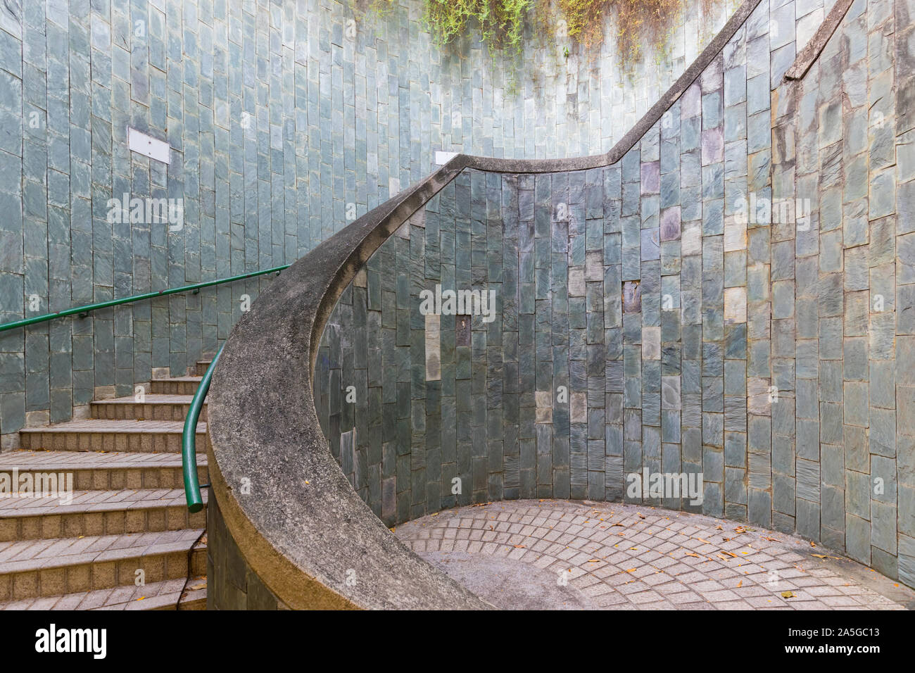 Spiral staircase of underground crossing in tunnel at Fort Canning Park ...