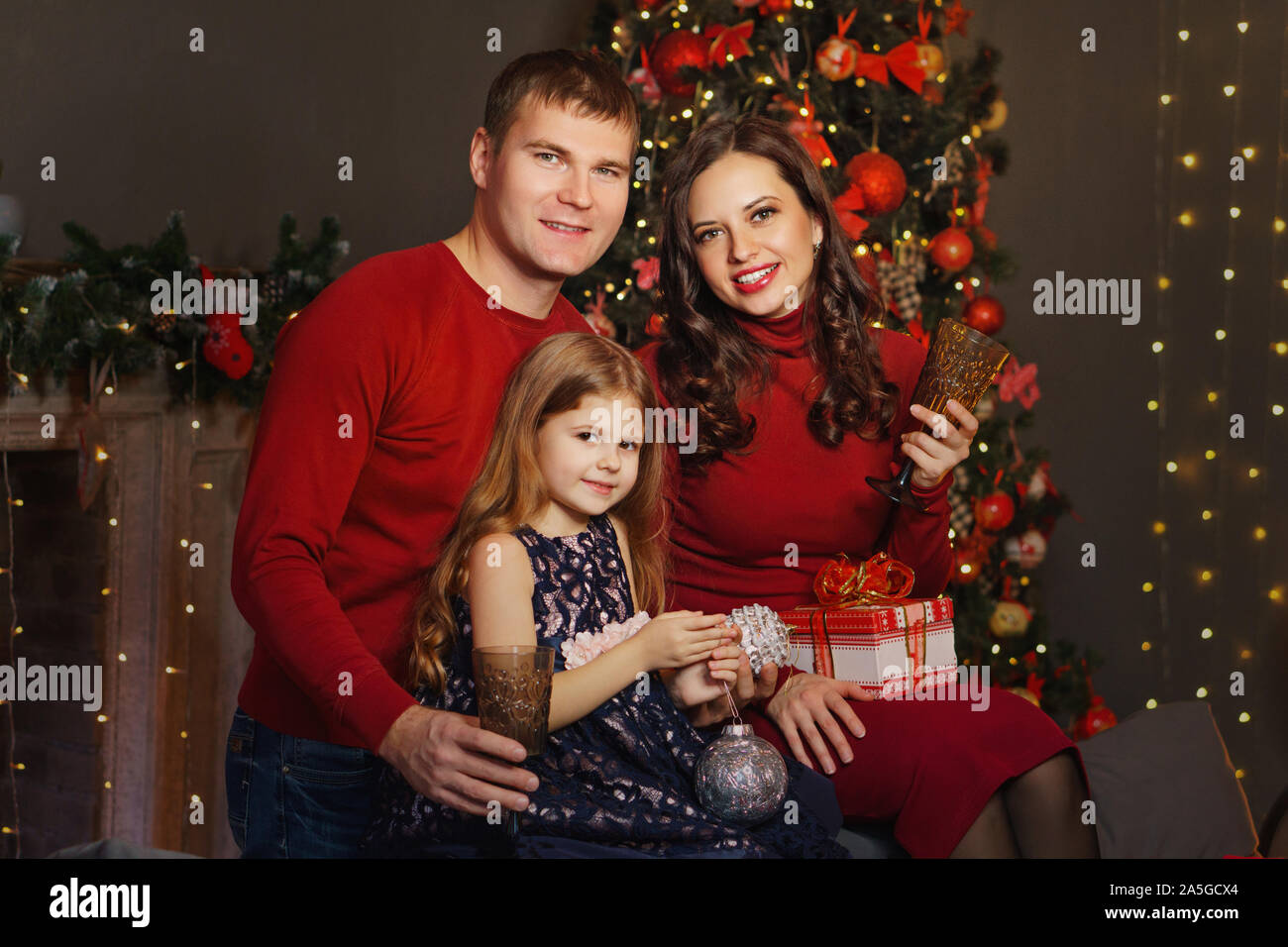 Friendly family celebrates Christmas. Living room in bright christmas ...
