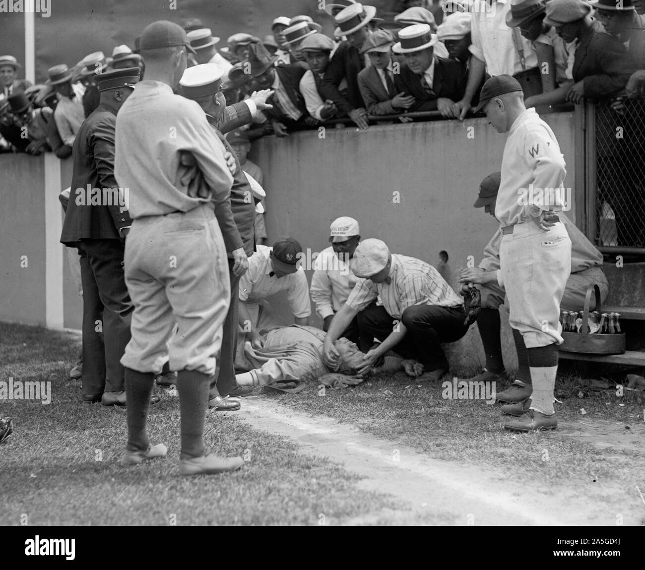 Photo shows baseball player Babe Ruth knocked unconscious, after he ran ...