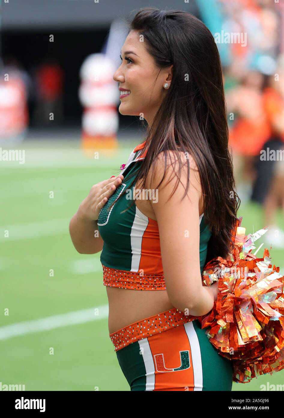 October 19, 2019: A Miami Hurricanes cheerleader listens to the US ...