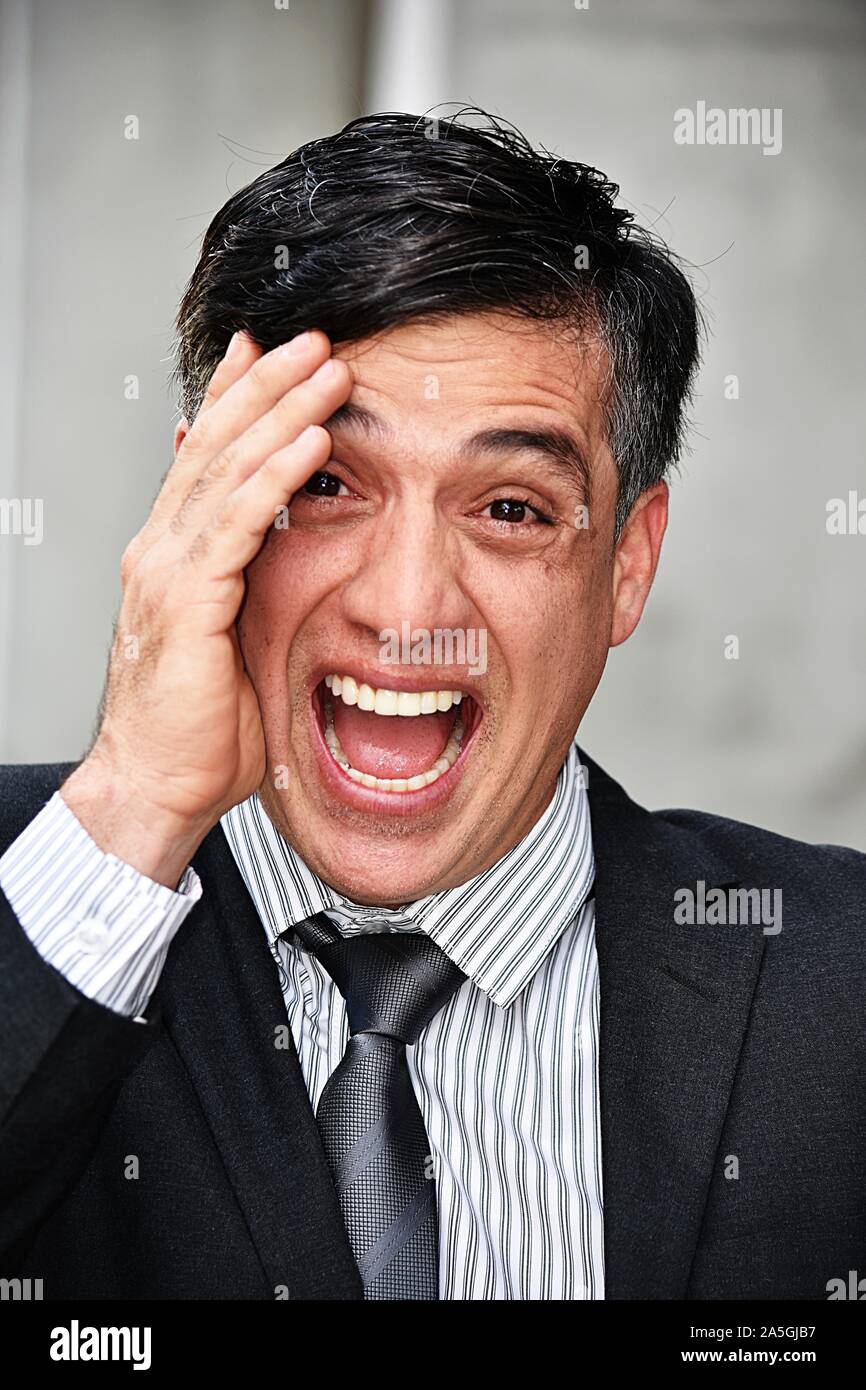 Laughing Latino Business Man Stock Photo - Alamy
