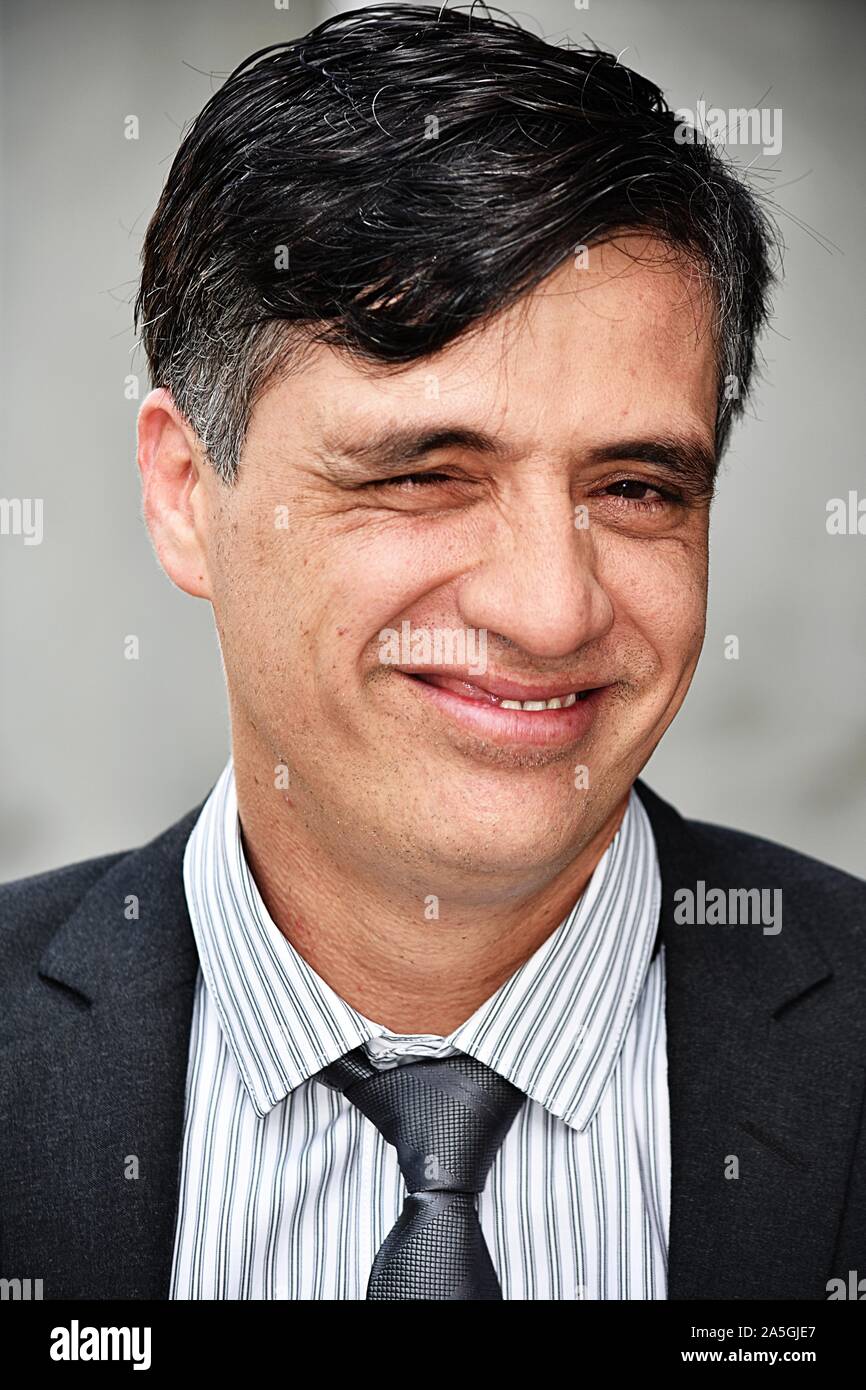 Smart Business Man Winking Stock Photo - Alamy