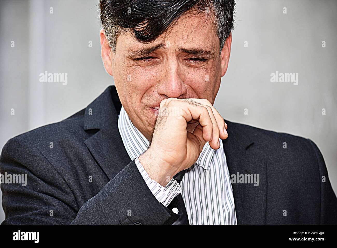 Crying Colombian Business Man Entrepreneur Stock Photo - Alamy